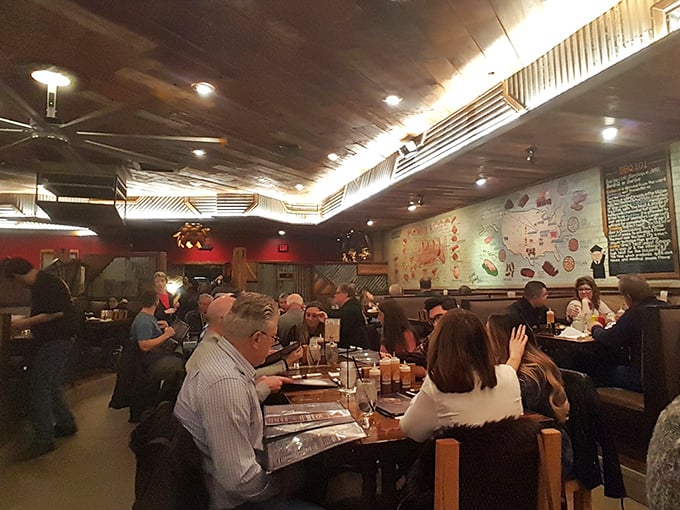 A packed house of diners united in the universal language of "mmm." Nothing builds community quite like shared barbecue appreciation.