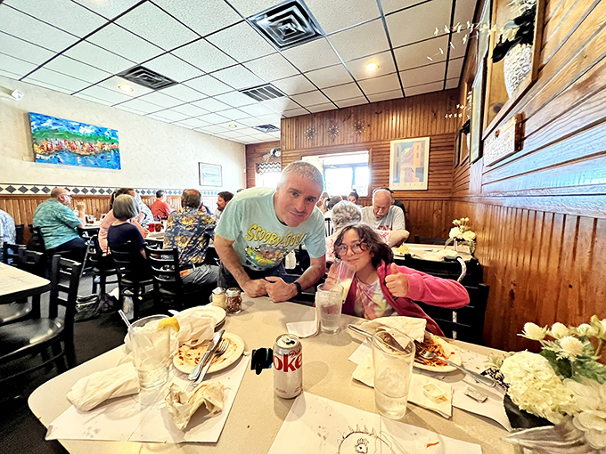 Happy diners experiencing the universal language of good food. That thumbs-up says what words can't—this meal was worth every minute of the drive.