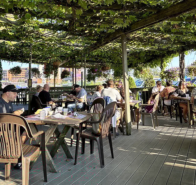 Dining under a canopy of leaves while lake breezes play through the vines. Some restaurants have ambiance—Smugglers' Wharf grows its own.