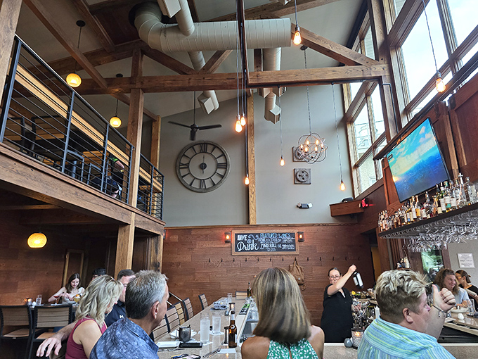 Soaring ceilings and warm wood tones create a space where conversations flow as freely as the wine. Architecture that understands good dining.
