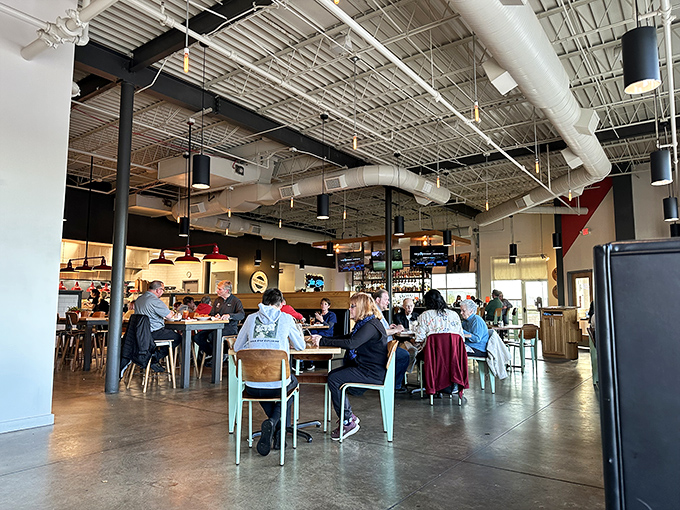 Where strangers become friends over shared food experiences, beneath industrial ceilings that somehow feel as comfortable as home.