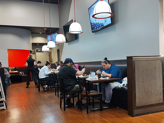 The dining room buzzes with the unmistakable energy of people having genuinely good meals, not just Instagram-worthy ones.