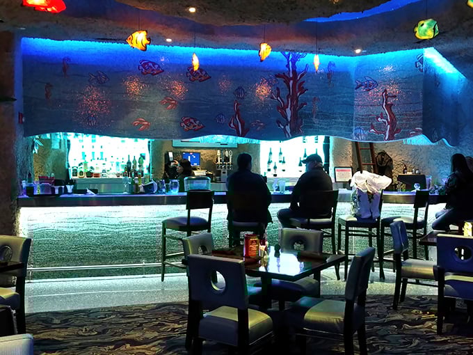 The dining area feels like you've stumbled into a secret underwater cave where someone thoughtfully installed a full-service bar.