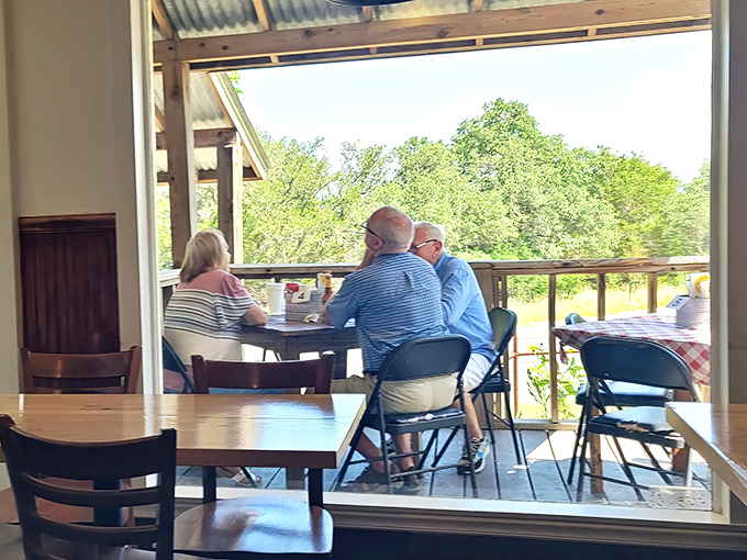 The covered porch offers diners a taste of Hill Country breezes with their burgers. Some views don't need mountains or oceans to be spectacular.