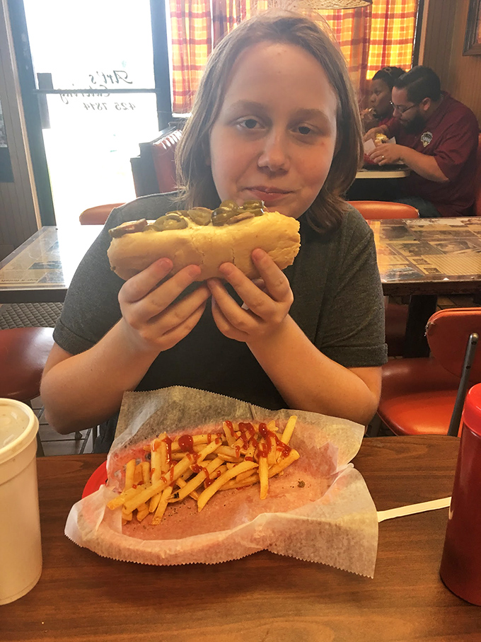 The look of someone who just discovered why people drive across counties for these sandwiches. That's pure sandwich enlightenment.