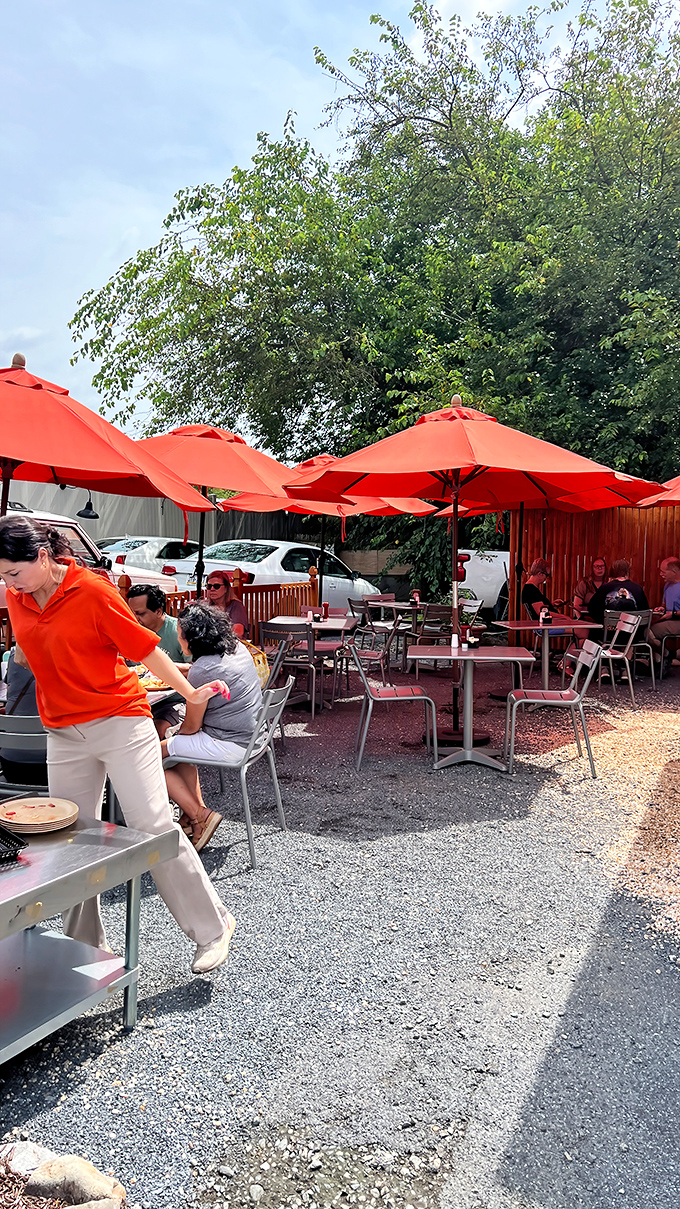 Outdoor dining under bright orange umbrellas&mdash;like eating breakfast in a cheerful poppy field, but with better service and no flying monkeys.