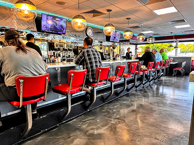 Counter culture at its finest—where strangers become temporary neighbors united by coffee and the universal language of "pass the syrup."