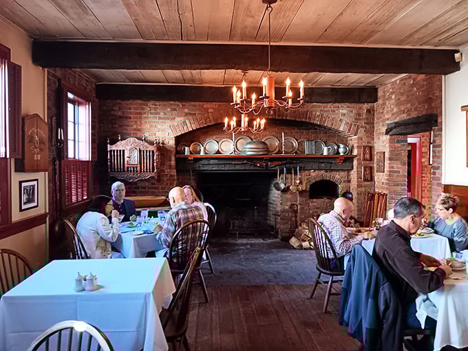 Where hearty meals meet hearth-side comfort. The massive brick fireplace isn't just for show &ndash; it's the soul of this historic dining space.