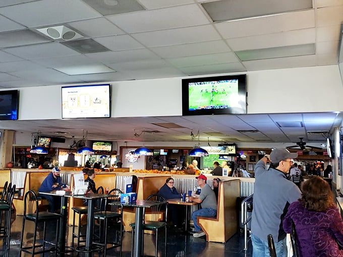 Where locals gather to catch the game, share stories, and demonstrate the proper technique for tackling oversized sandwiches without wearing them home.