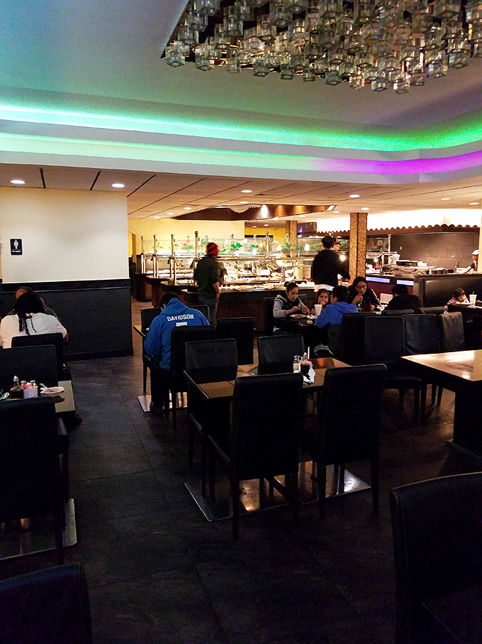 Diners scattered throughout like chess pieces, each plotting their next strategic move toward buffet domination.