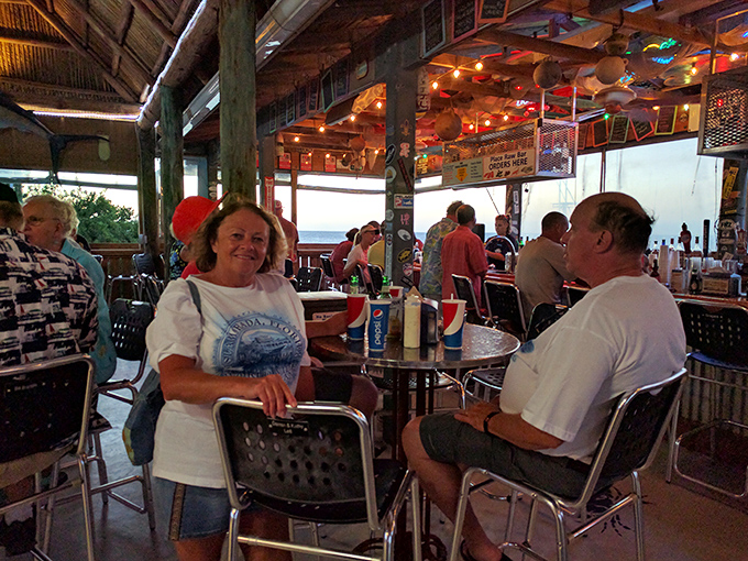 Happy diners sharing stories and stone crab claws in authentic Florida Keys fashion.