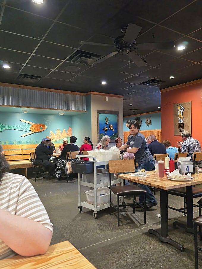 A bustling dining room where strangers become friends, united by the universal language of "pass the tartar sauce, please."