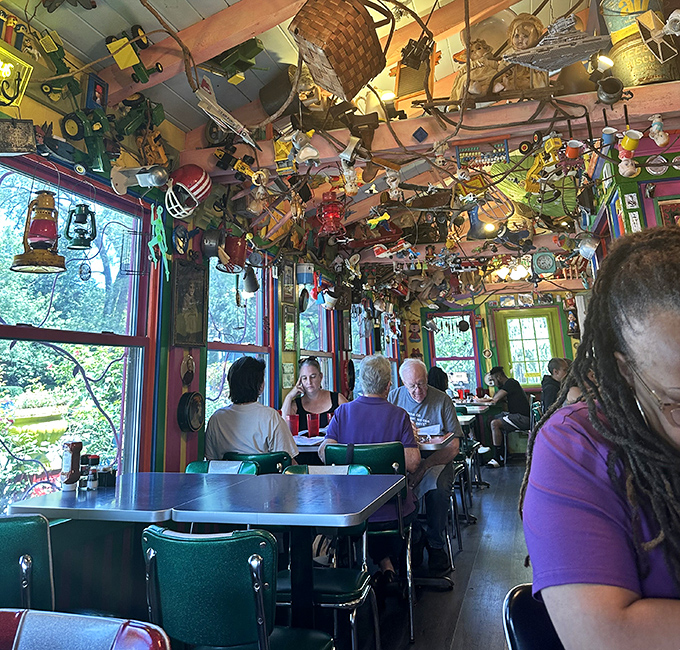 Happy diners surrounded by controlled chaos, proving that great food transcends any decorating scheme.