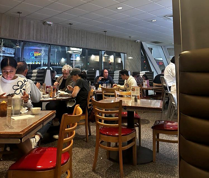 Night owls, early birds, and everyone in between find common ground in these booths, united by the universal language of comfort food.