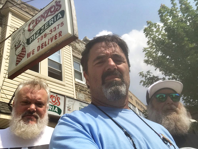 Loyal customers who've probably been debating the merits of various cheesesteak techniques at this spot since before cell phones existed.