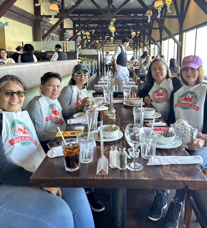Dining becomes a communal celebration when the ocean is your backdrop and seafood bibs become the most fashionable accessory at the table.