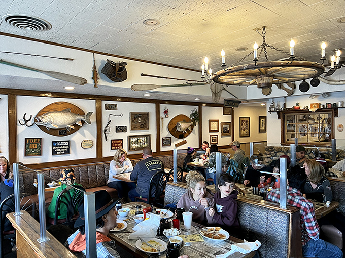 Families fill cozy booths beneath mounted fish and vintage signs, creating the quintessential small-town dining experience everyone craves.