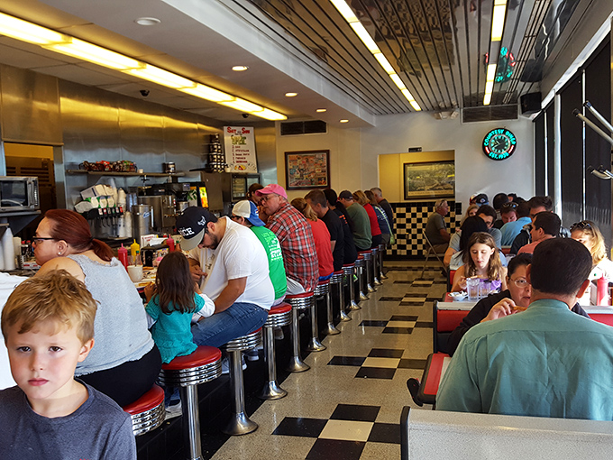 Democracy in action—construction workers, families, and suited professionals all finding common ground in the pursuit of excellent diner fare.