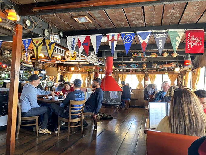 Where locals and visitors break bread together under colorful flags. That gentle rocking? It's just the barge reminding you you're floating.