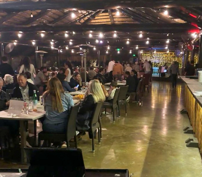 Evening at Schnebly transforms from winery to wonderland. String lights overhead turn ordinary conversations into memorable scenes from your favorite movie.