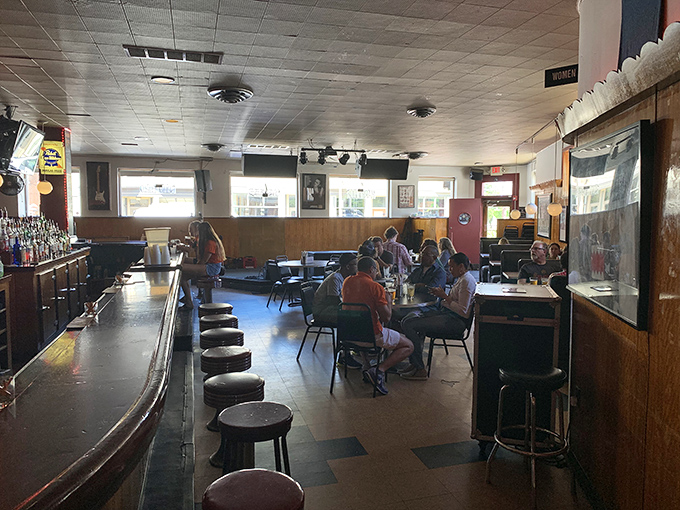 Fellow adventurers contemplate their next topping combination while savoring their current edible masterpiece in comfortable silence.