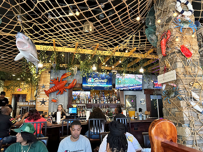 Under fishing nets and watchful shark eyes, patrons engage in Baltimore's favorite pastime: the sacred ritual of seafood consumption.