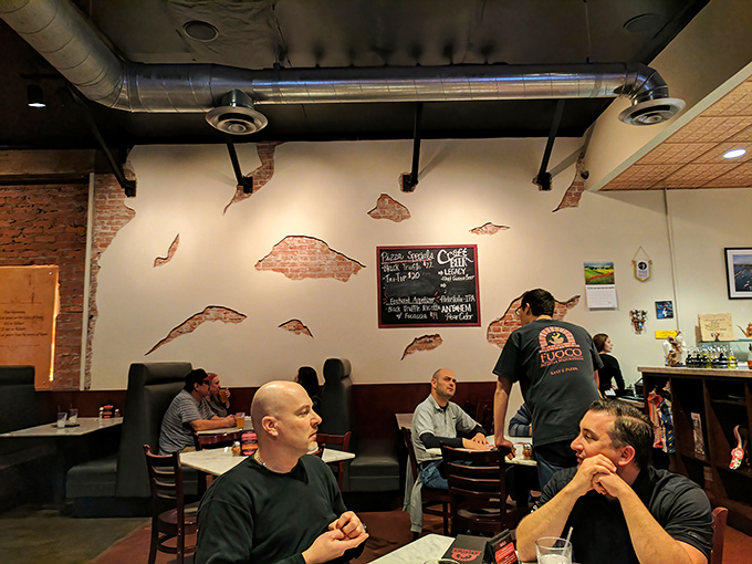 The distressed brick wall isn't a design choice&mdash;it's where happiness has been repeatedly slamming into reality for years.