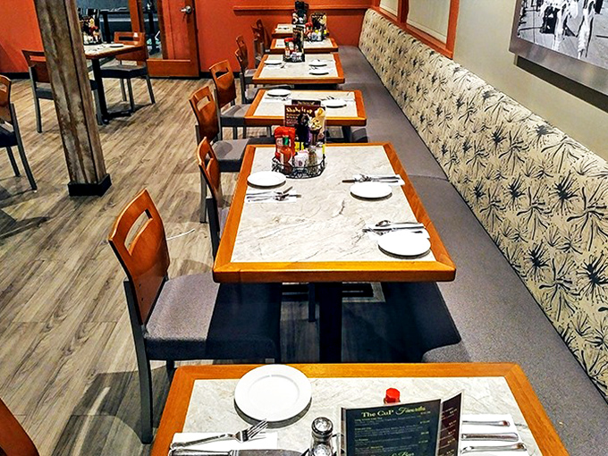 Clean lines, warm wood tones, and thoughtfully spaced tables create an inviting dining room where conversations flow as freely as the coffee.