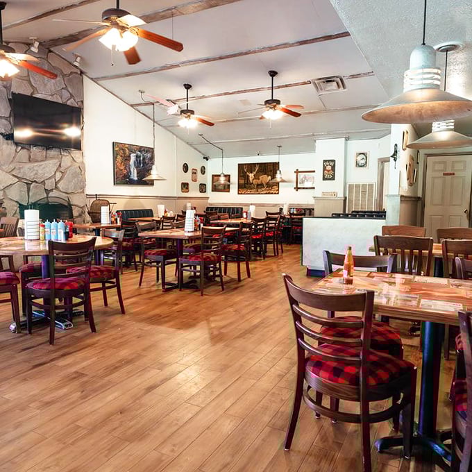 Ceiling fans lazily spin above a dining room where the only thing more abundant than wood and stone is the anticipation of what's coming from the kitchen.