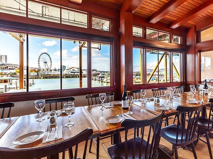 Window seats offer dinner and a show&mdash;featuring the bay, boats, and occasionally, the perfect sunset cameo appearance.