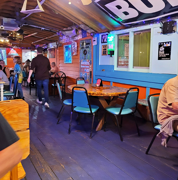 Where neon meets nostalgia in a dining room that feels like your eccentric uncle's Florida hideaway. Comfort with character.