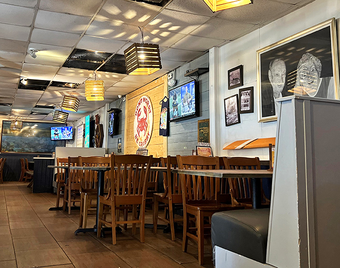Wooden chairs, nautical d&eacute;cor, and enough TVs to catch the game &ndash; this dining area feels like the living room of that cool uncle who moved to the beach.