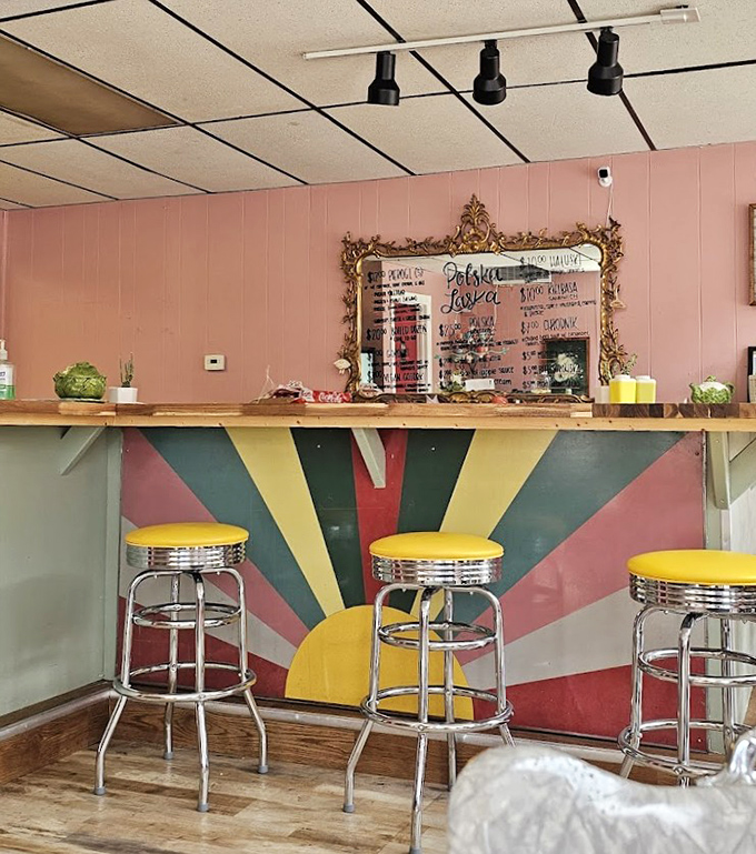 The counter's sunburst design radiates mid-century optimism, while those yellow stools are perfectly positioned for pierogi consumption and people-watching.