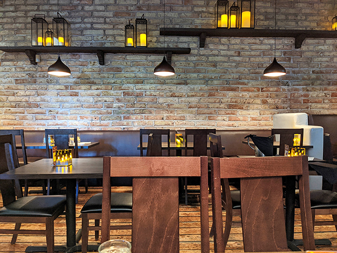 Exposed brick and glowing lanterns create the perfect mood lighting for falling in love&mdash;with your dinner or your companion.
