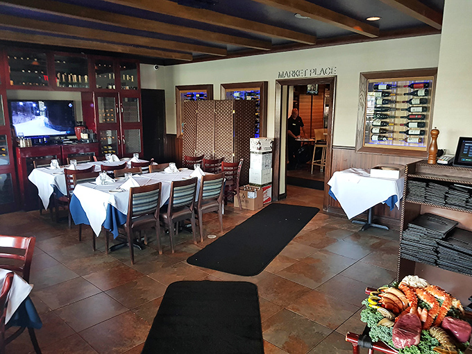 The Market Place dining area offers an intimate setting with wine displays that suggest someone here takes their pairings very seriously.