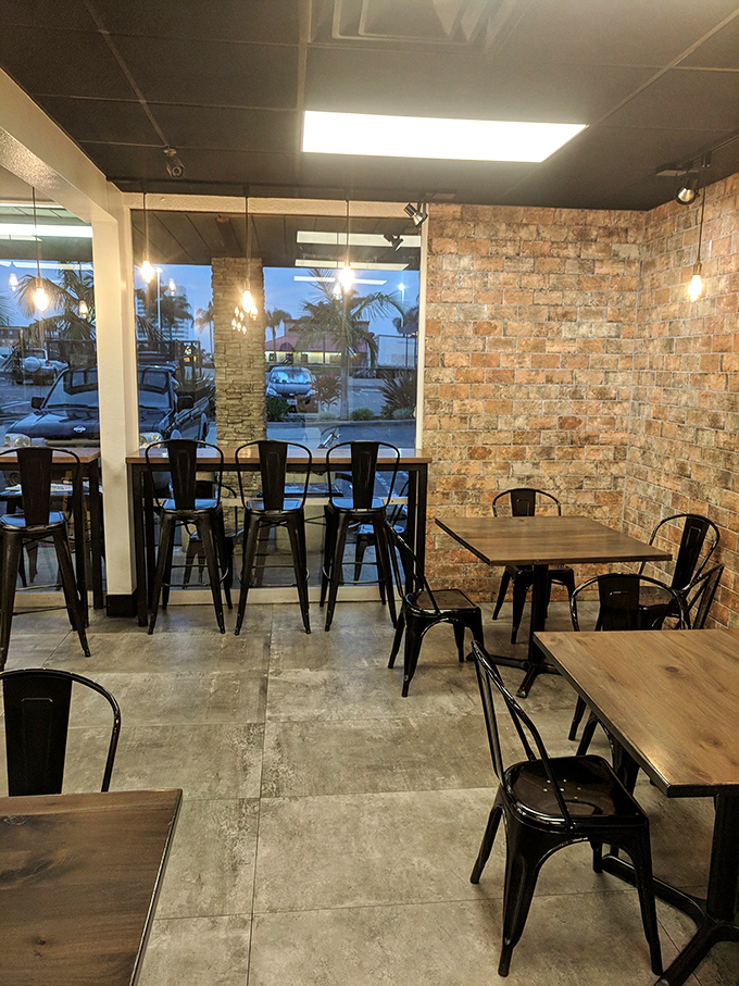 Modern industrial meets cozy comfort in The Donuttery's dining area, where donut dreams are devoured one bite at a time.