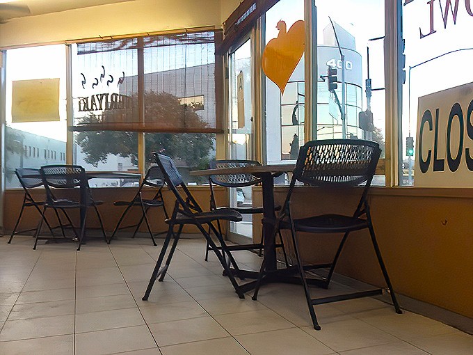 A few tables by the windows where morning light makes even the simplest meal feel like a celebration.