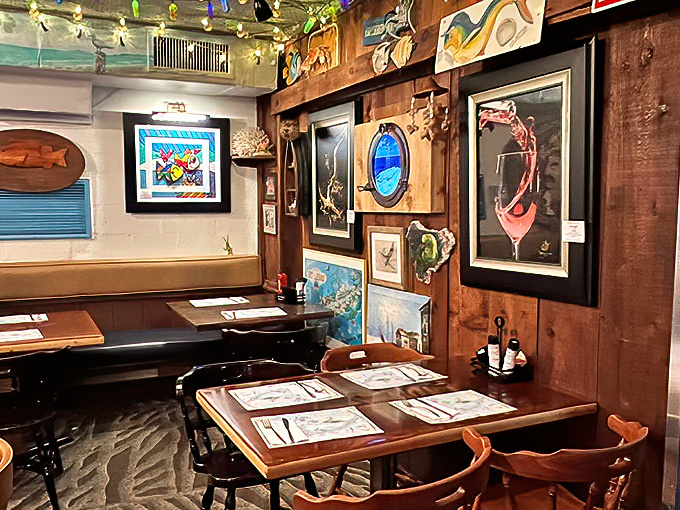 Every table tells a story at The Fish House, where nautical artwork and warm wood paneling create the quintessential Keys dining experience.
