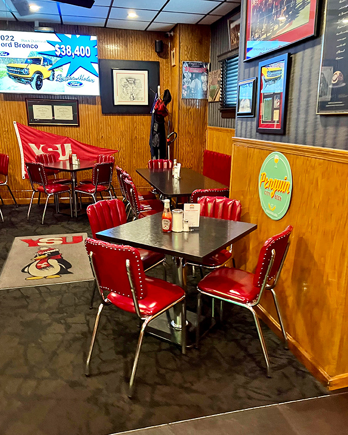 The Penguin City Beer sign watches over diners like a friendly mascot. This room has heard decades of Youngstown stories.