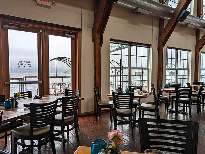 Tables positioned for maximum river-gazing prove that sometimes the best seasoning is simply a breathtaking view of nature's majesty.