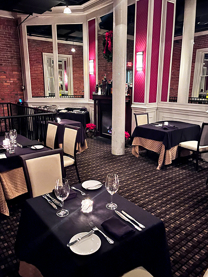 The rich burgundy accents and white trim give this dining area the feel of a private club where everyone's welcome. Holiday decorations add a festive touch.