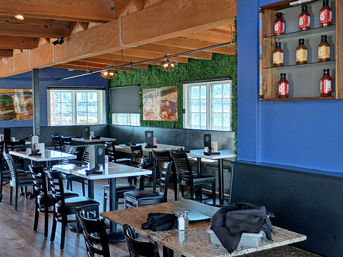 Blue walls and wooden beams create a maritime atmosphere where every table feels like you've scored the captain's private dining room.