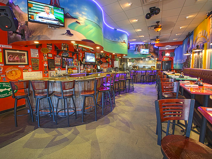 The bar area glows with neon energy, creating the perfect backdrop for seafood that deserves its own spotlight.