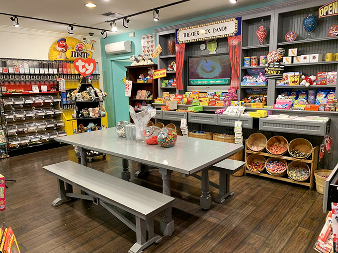 The "Theater Box Candy" sign hints at movie night nostalgia, while the communal table invites you to make new sweet memories.