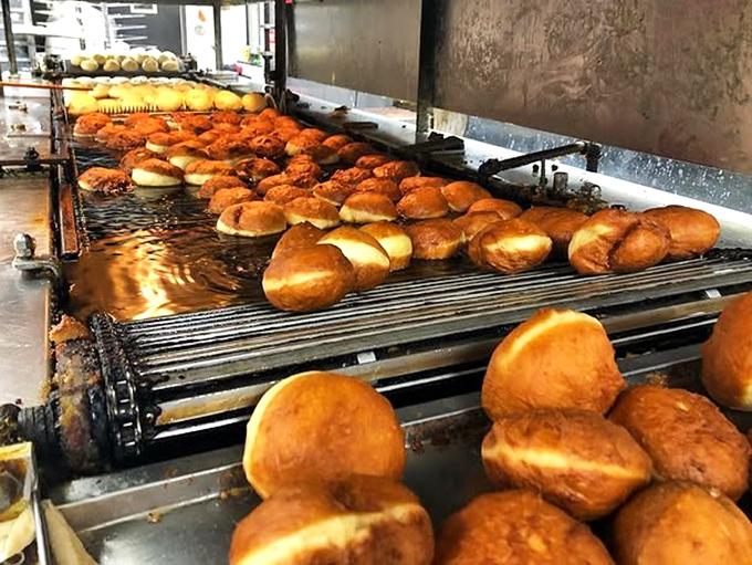 The magic happens right here, where dough transforms into dreams one golden cruller at a time.