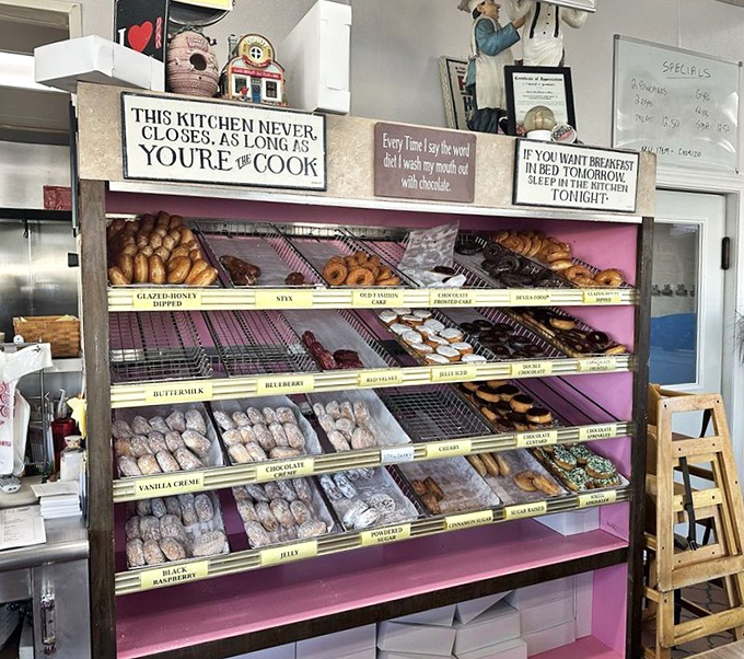 "This kitchen never closes as long as you're the cook"&mdash;words to live by. The pink display case houses donuts that would make Homer Simpson weep with joy.