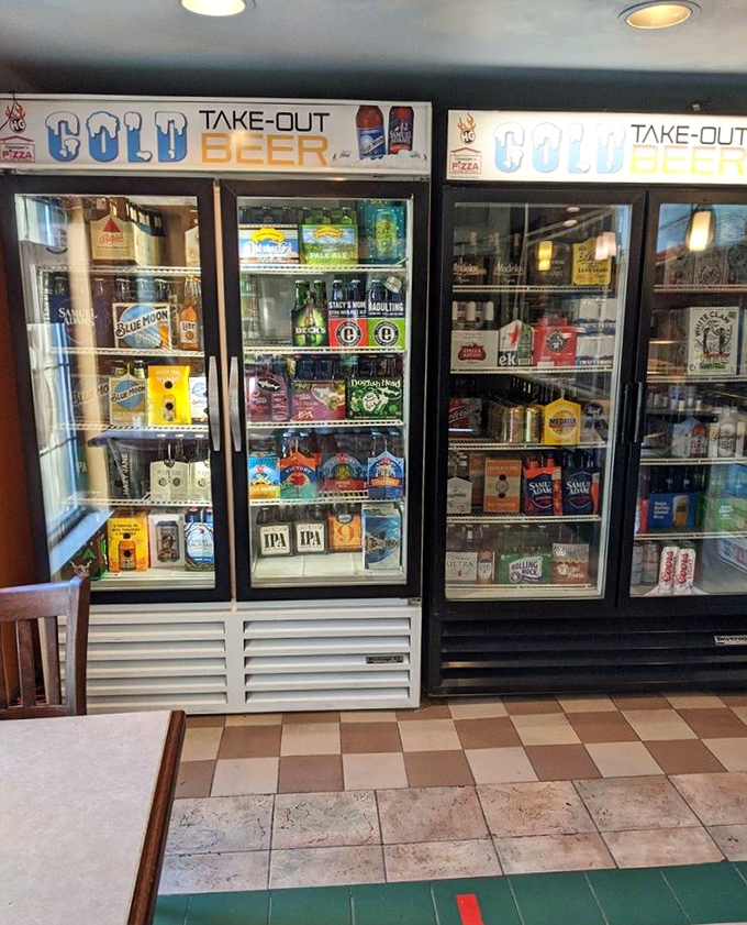 The beer cooler stands like a shrine to hoppy devotion, offering liquid refreshment for every palate from craft connoisseur to nostalgic traditionalist. 
