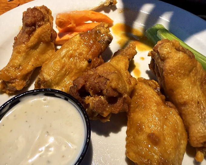 Wings that don't need a swimming pool of sauce to make their point—crispy, meaty, and unapologetically addictive.