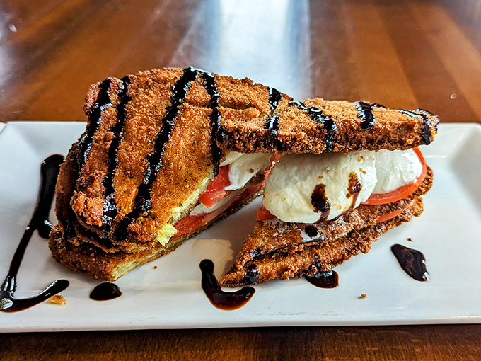 The Eggplant Stack isn't just an appetizer&mdash;it's a towering achievement of Mediterranean engineering with fresh mozzarella and balsamic reduction.