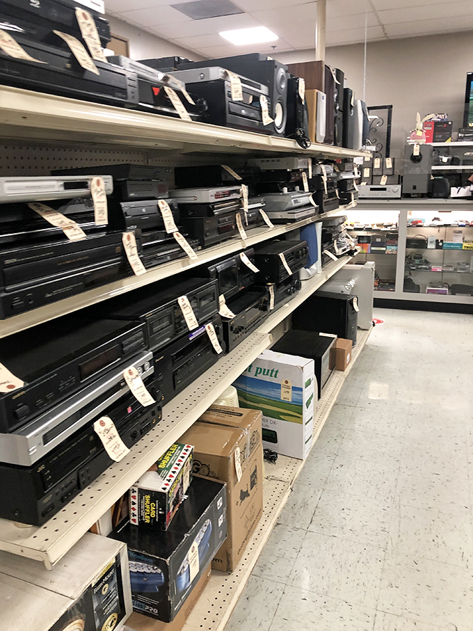 The electronics graveyard, where VCRs and stereo systems from three decades past wait for nostalgic tech enthusiasts.